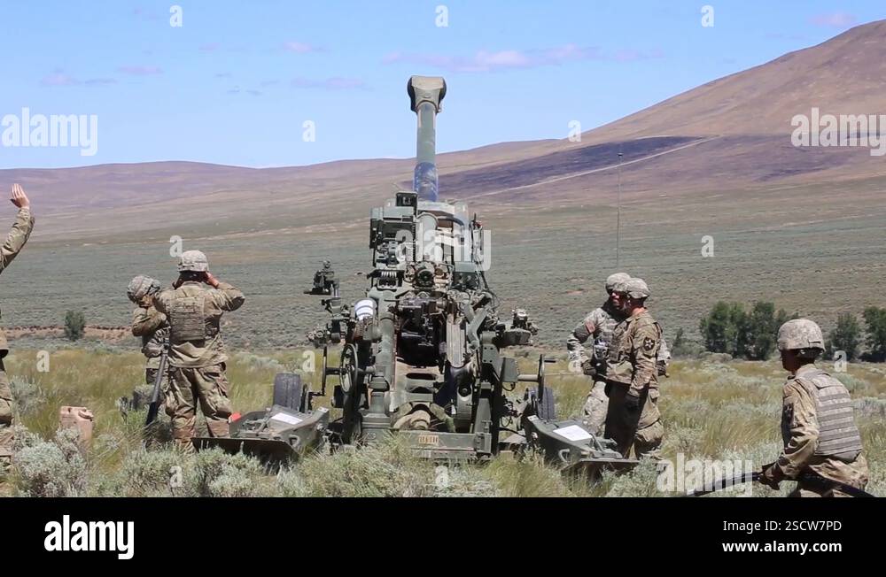 Army soldiers fire M777 Howitzer during artillery raid Stock Video ...