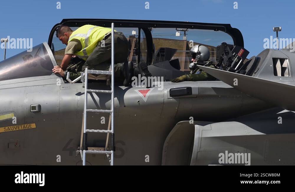Aircraft marshaller securing Dassault Rafale pilot harness Stock Video ...