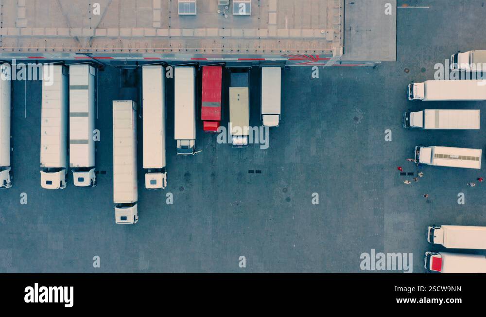 Aerial top view of many semi-trailers trucks standing for load/unload ...