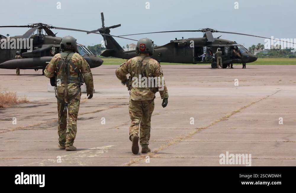 Airmen walking towards UH-60 Black Hawk helicopters Stock Video Footage ...