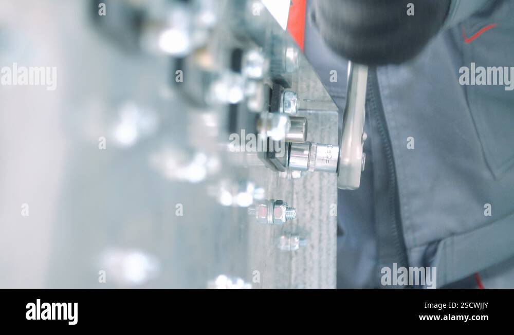 Human hand working with universal socket wrench using nozzle ...
