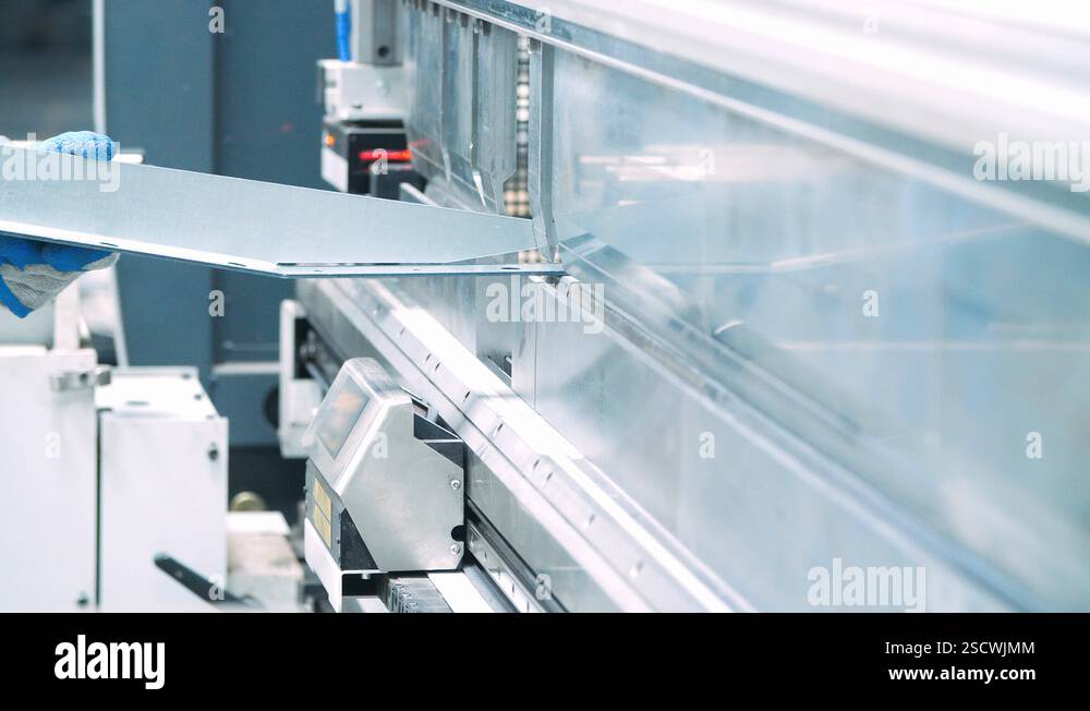 Production of metal angles using sheet bending machine. Hydraulic press ...