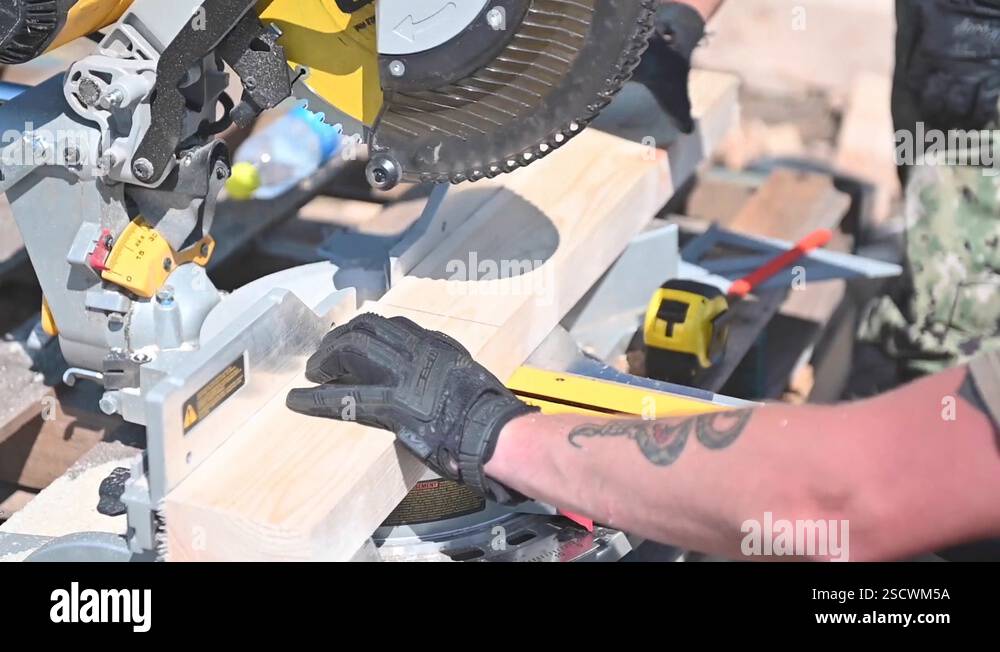 Soldier cutting lengths of timber with circular saw Stock Video Footage ...