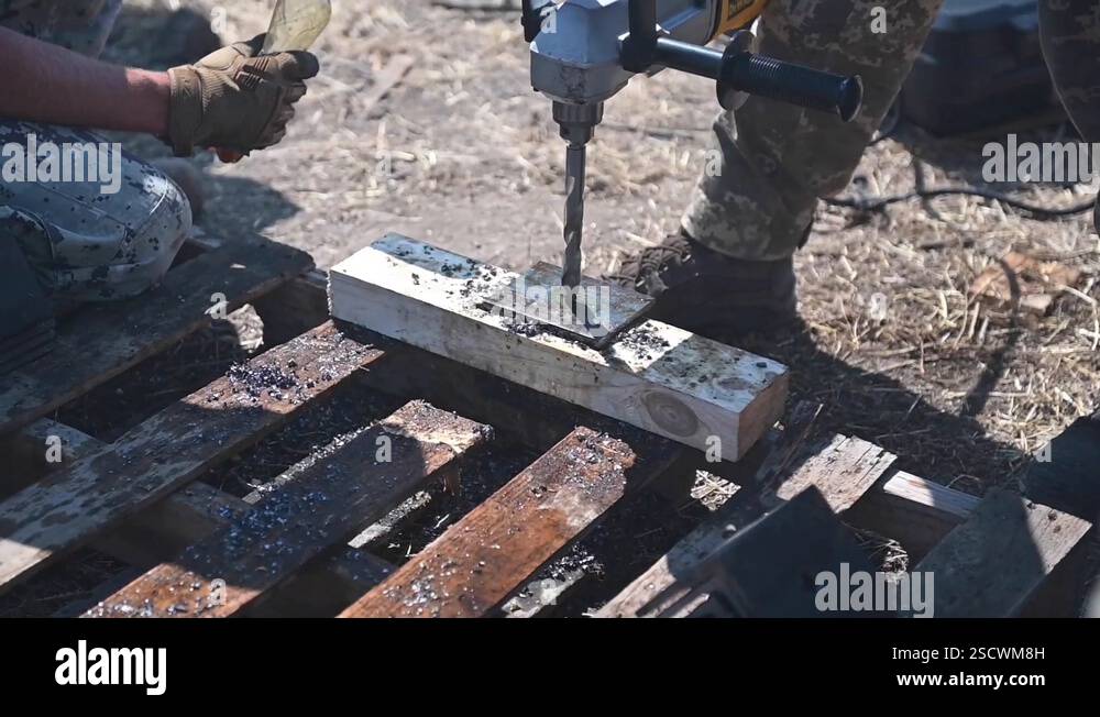 Soldier drilling steel bracket for construction of sentry post Stock ...