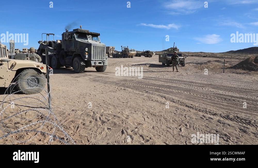 Military low loader departing Fort Irwin for Operation Hickory Sting ...