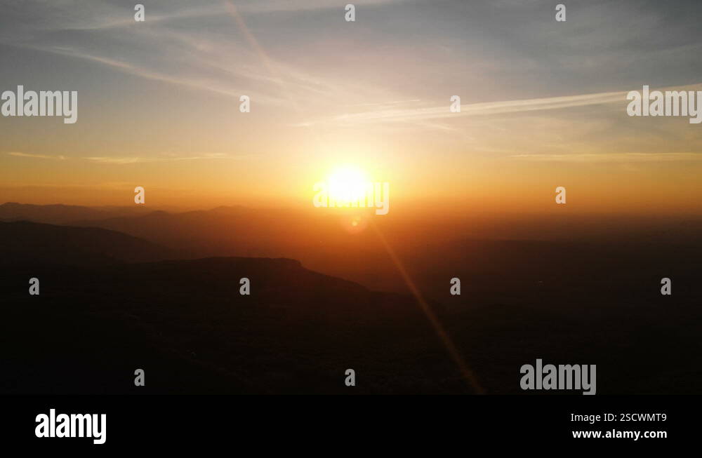 Aerial view of the horizon at sunset from a height. The end of the day ...
