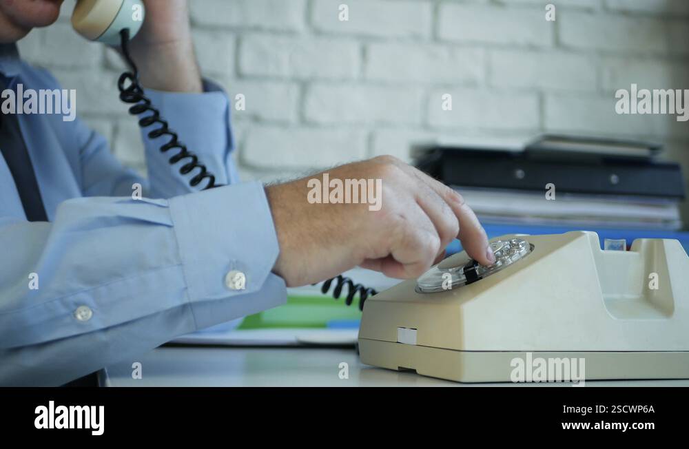 Businessman in Office Room Make a Phone Call Using Old Telephone Stock ...