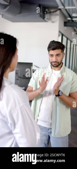 Vertical video: Discussing project details, colleagues having ...