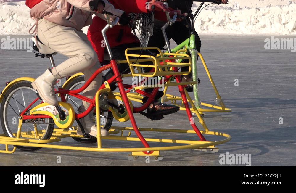 Slow motion of people riding ice bicycle at frozen Songhua river in ...