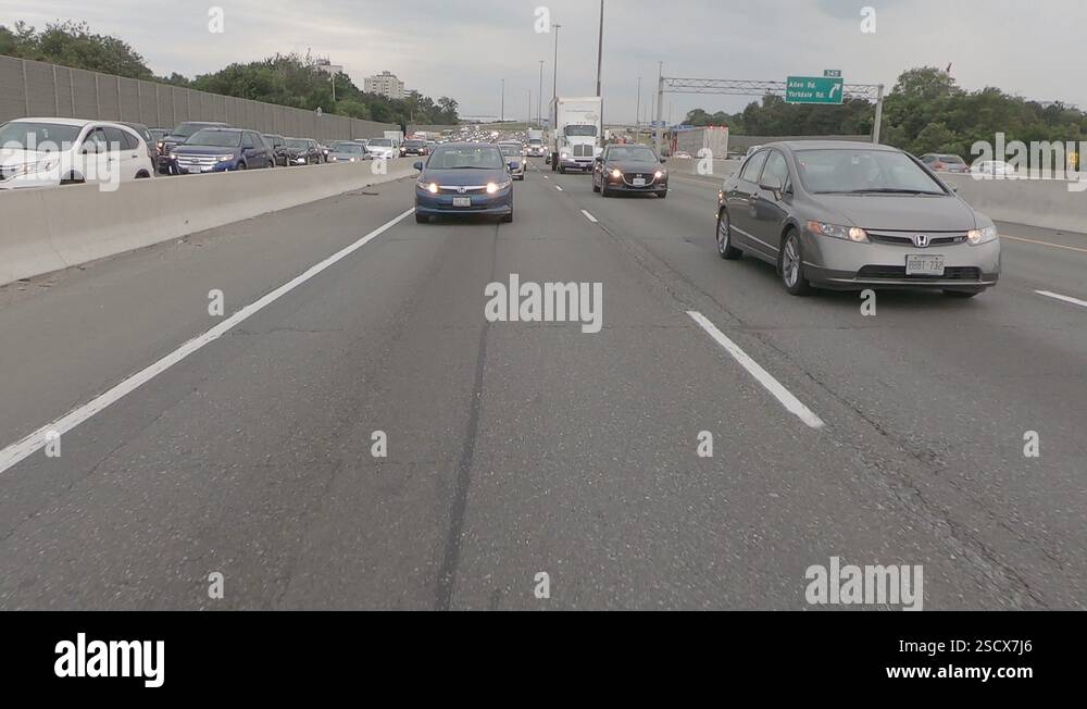 Driving plate reverse POV highway driving with cars and trucks traffic ...