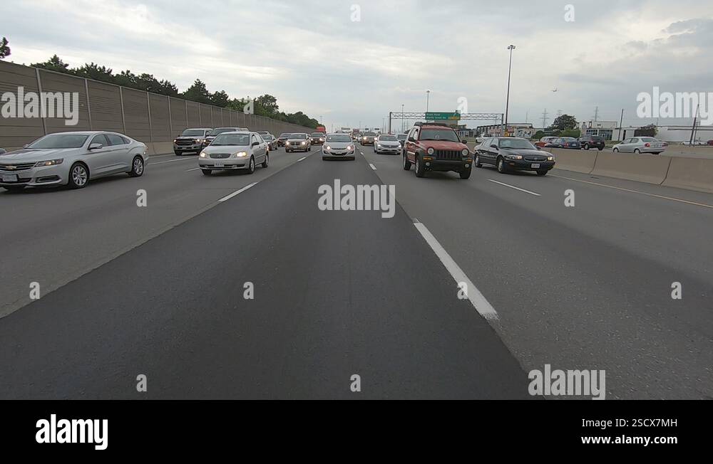 Driving plate reverse POV highway driving with cars and trucks traffic ...