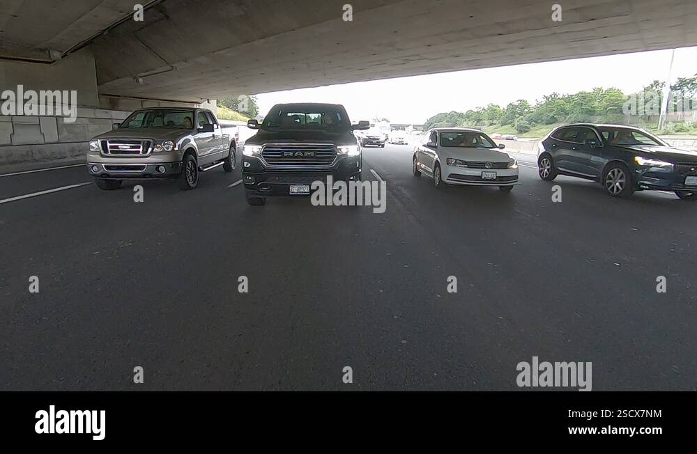 Driving plate reverse POV highway driving with cars and trucks traffic ...