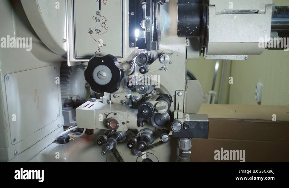 Old 35 mm movie projector working. Tape drive mechanism of 35mm cine ...