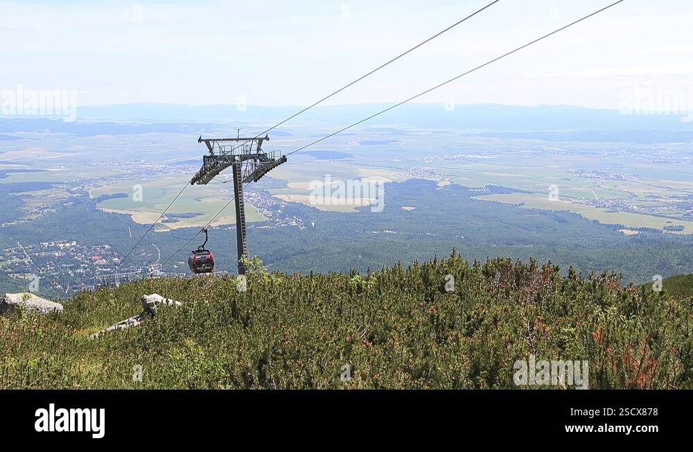 Cable cars moving up and down at High Tatras mountains in Slovakia ...