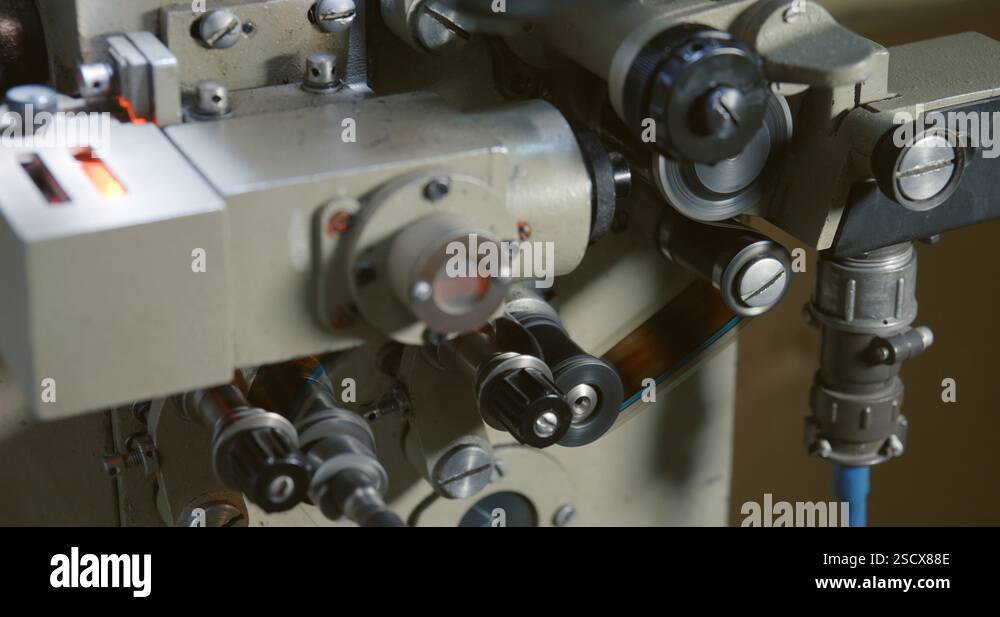 Old 35mm movie projector. The movement of the cine-film through the ...
