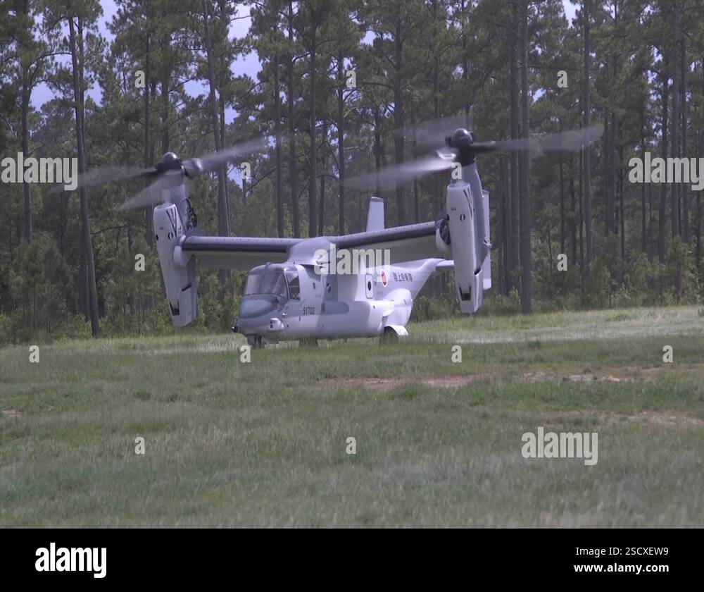 Japanese V-22 Osprey preparing for take off from grass Stock Video ...