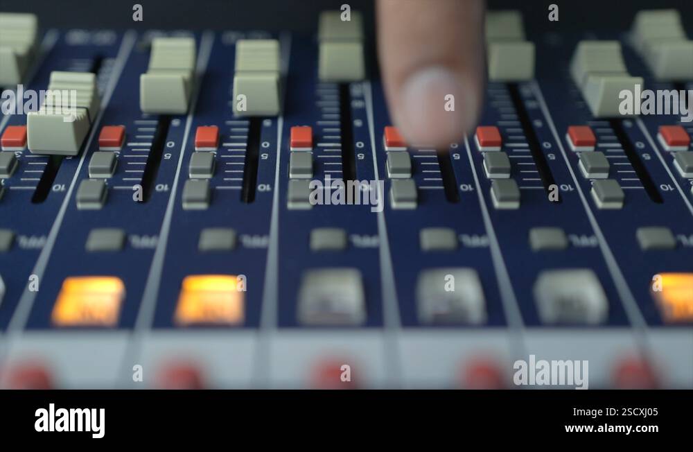 Man adjusting aound an Audio mixer, Working with sound mixing console ...