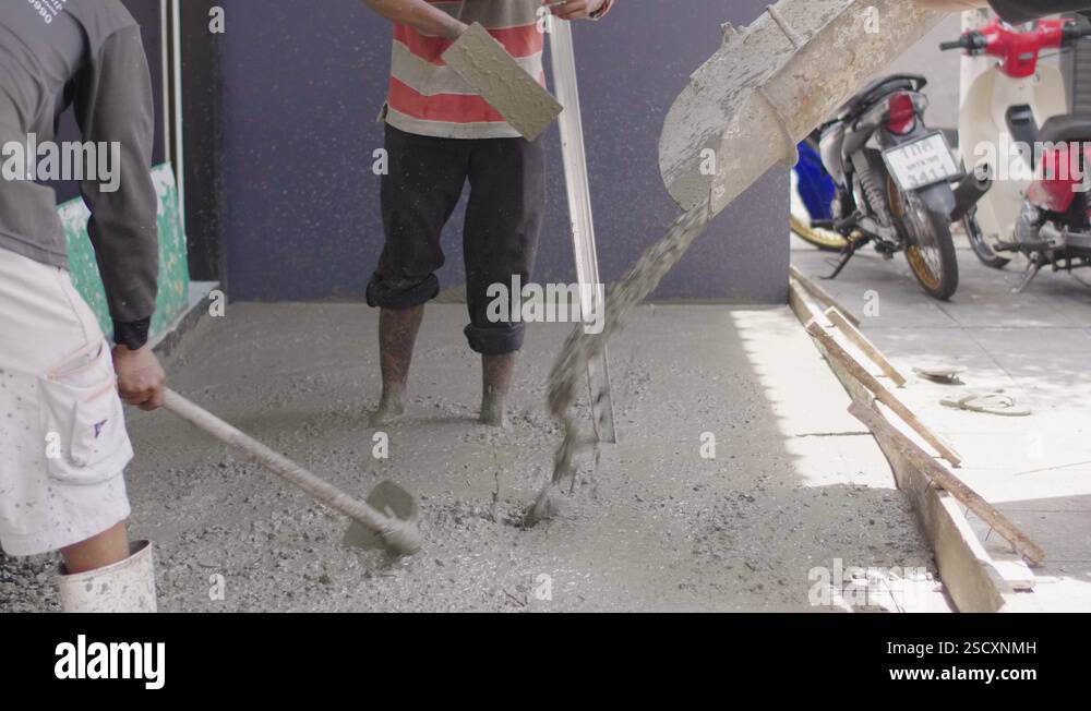Anonymous Workers are pouring concrete For root work Stock Video ...