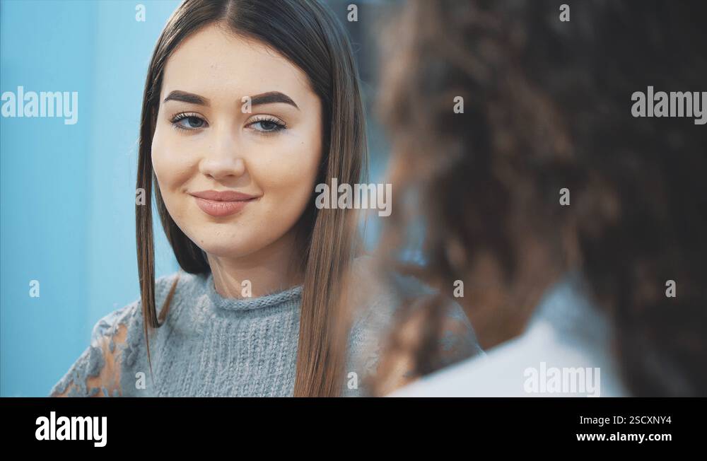 Young cute good girl friends, met in a cafe. Beautiful young girls ...