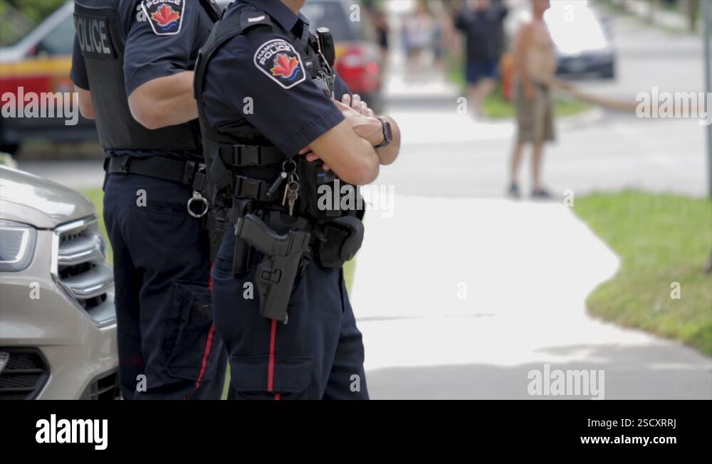 Police and fire fighters at a crime scene. Police officers and firemen ...
