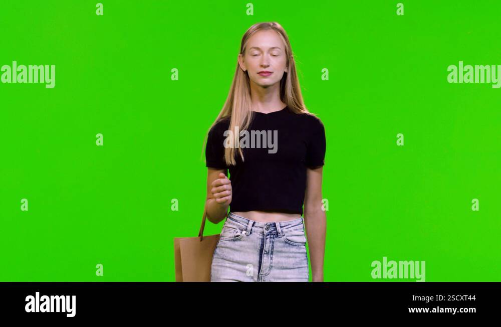 Casual customer walking and looking around over green screen Stock ...