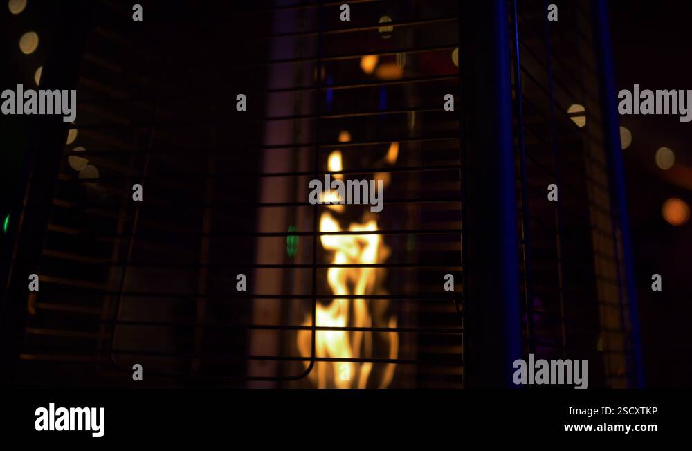 fire in the street heater in a glass tube behind Stock Video Footage ...