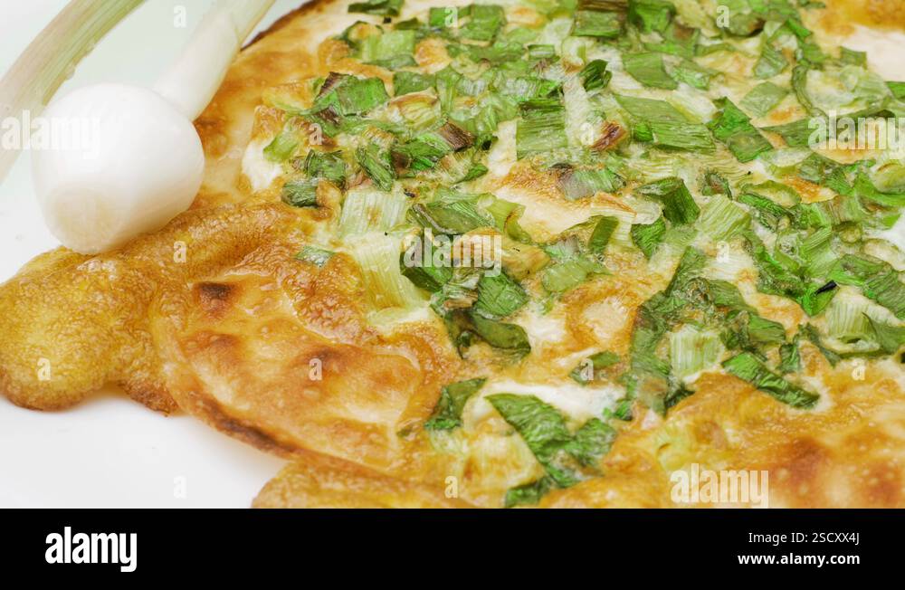 Onion pizza on white dish. National cuisine of Udmurts: The Tabani ...
