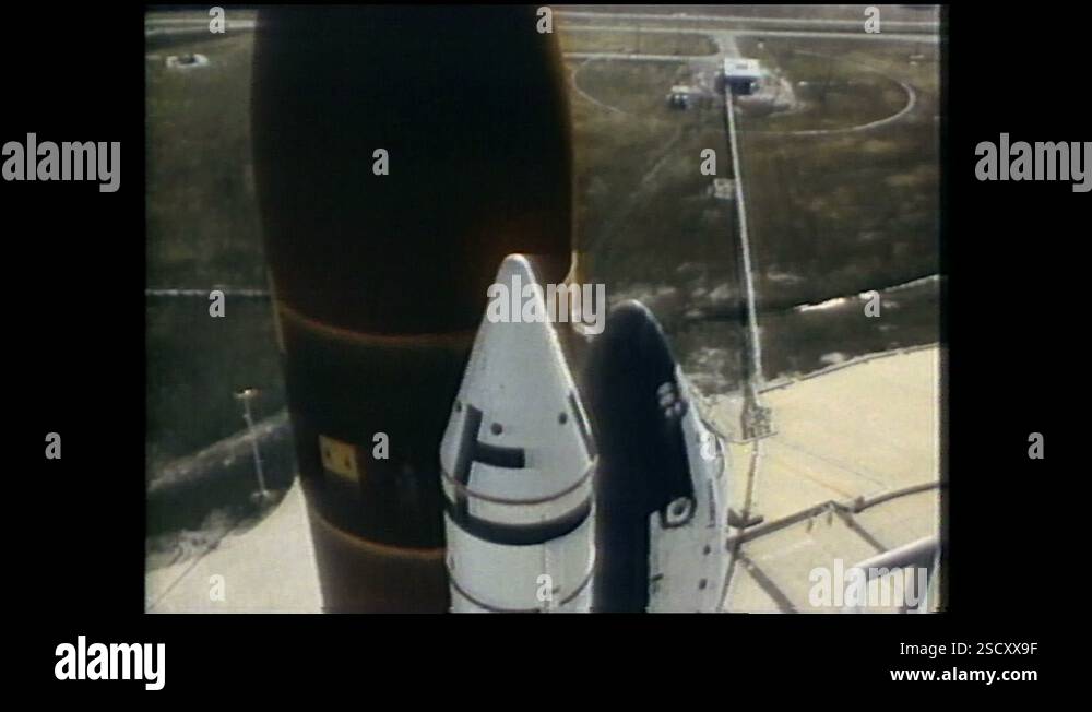 1990s: Space shuttle launches from platform. Space shuttle flying into ...