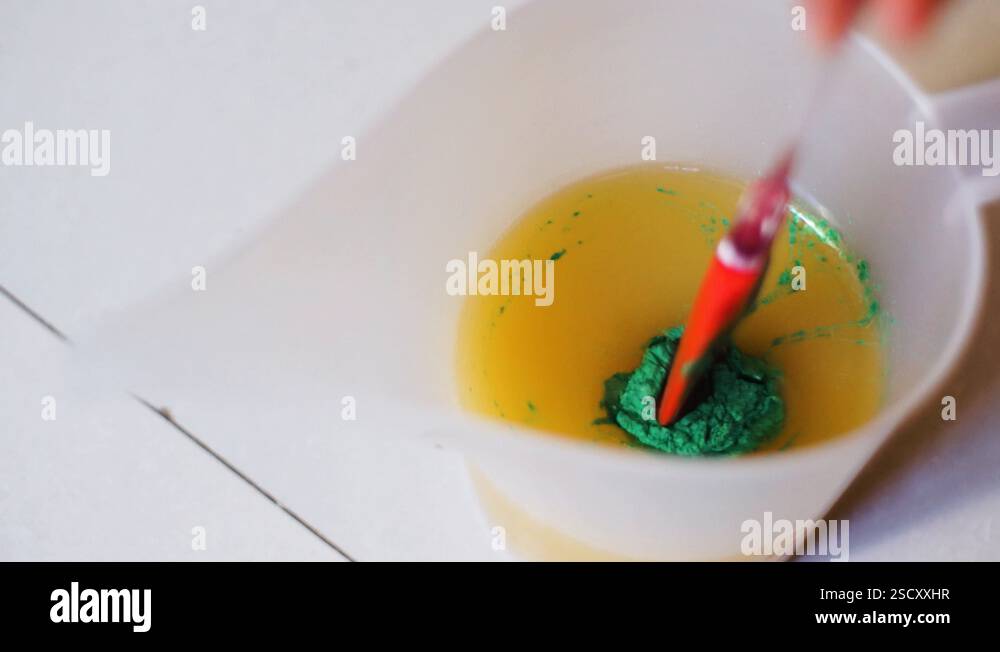 Mixing red green mica color colorant into the oil soap mix to make ...