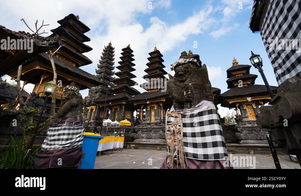 Timelapse from below of statues and towers of Pura Besakih, temple ...