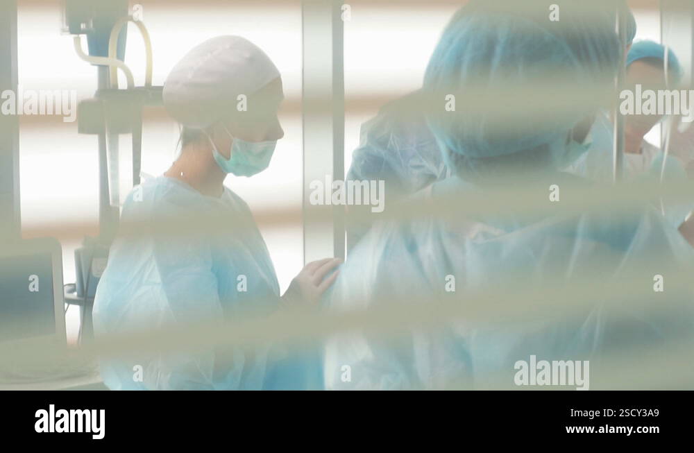 Team of doctors repair and diagnose internal problems Stock Video ...