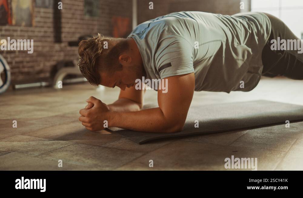 Strong Masculine Male and Two Fit Atletic Women Hold a Plank Position ...