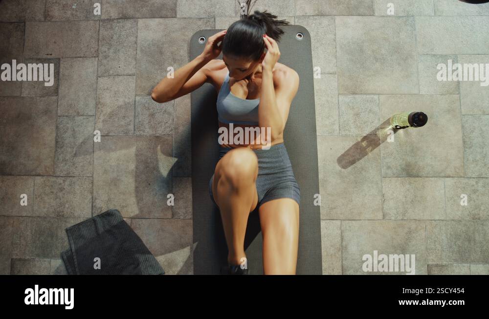 Top View of Professional Female Bodybuilder Doing Bicycle Crunches ...