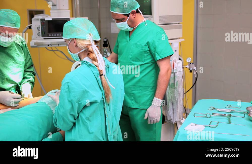 Patient being operated by a team of surgeon Stock Video Footage - Alamy
