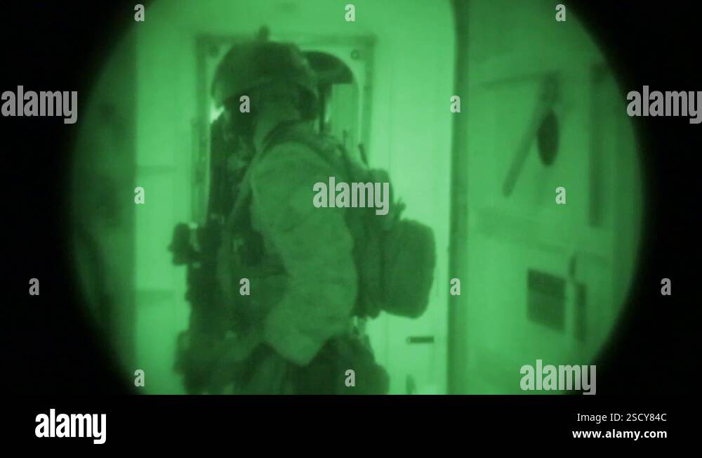 Night vision imagery of U.S. Marines conducting search and seizure ...