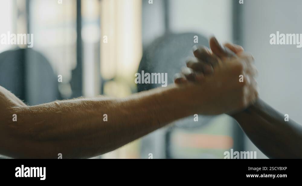Cinematic shot of two young different ethnicities boxers shaking hands ...