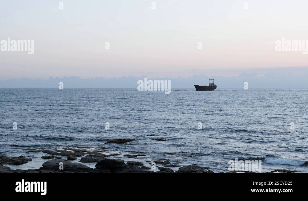 Old rusty ship stranded at sea. Beautiful view of seascape. Sea with ...