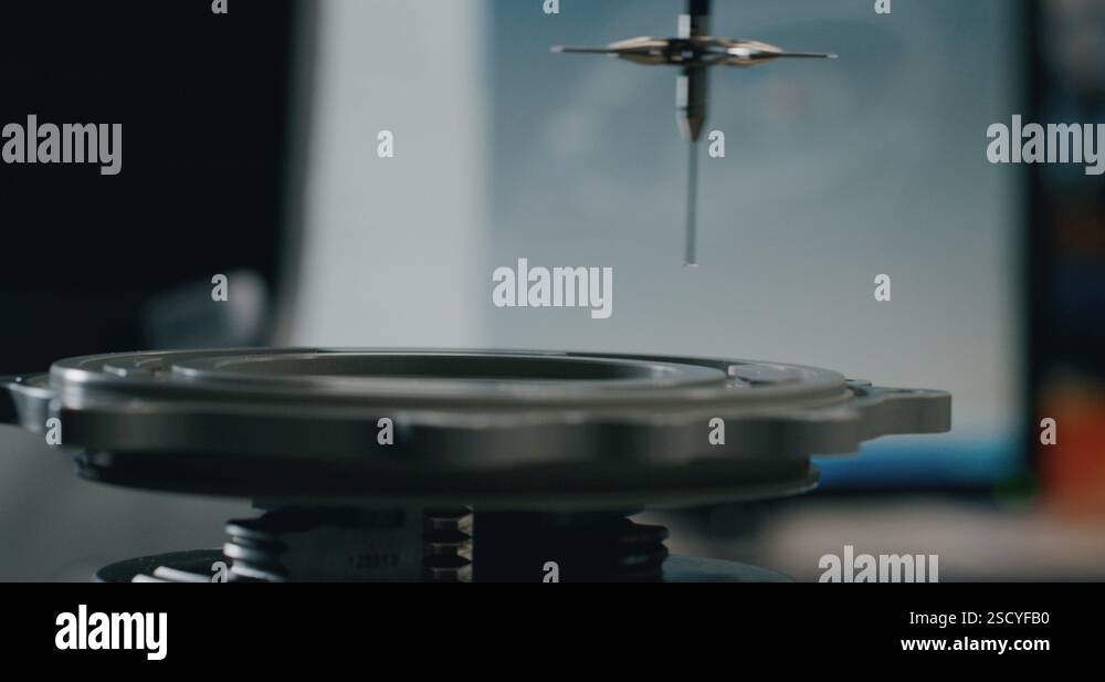 Slow motion macro of specialist is working on production of gearing ...