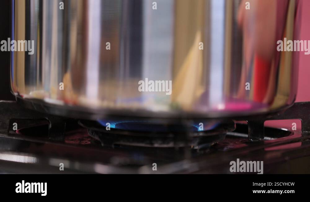 Stainless steel stock pot cooking on gas eye stovetop burner C Stock ...