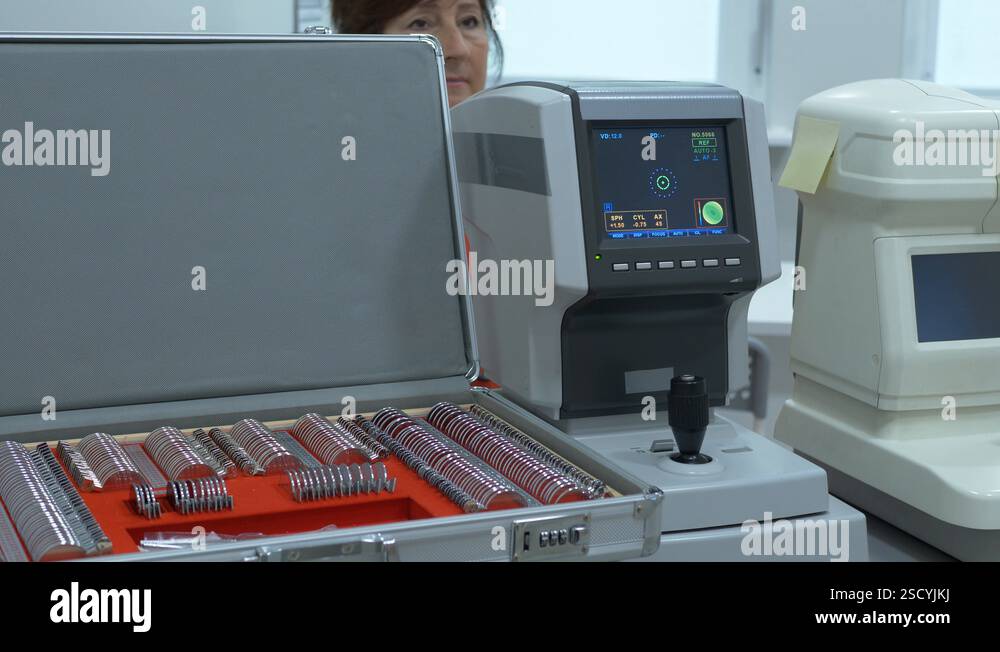 Female patient closeup eye on a eye examination modern autorefractor ...