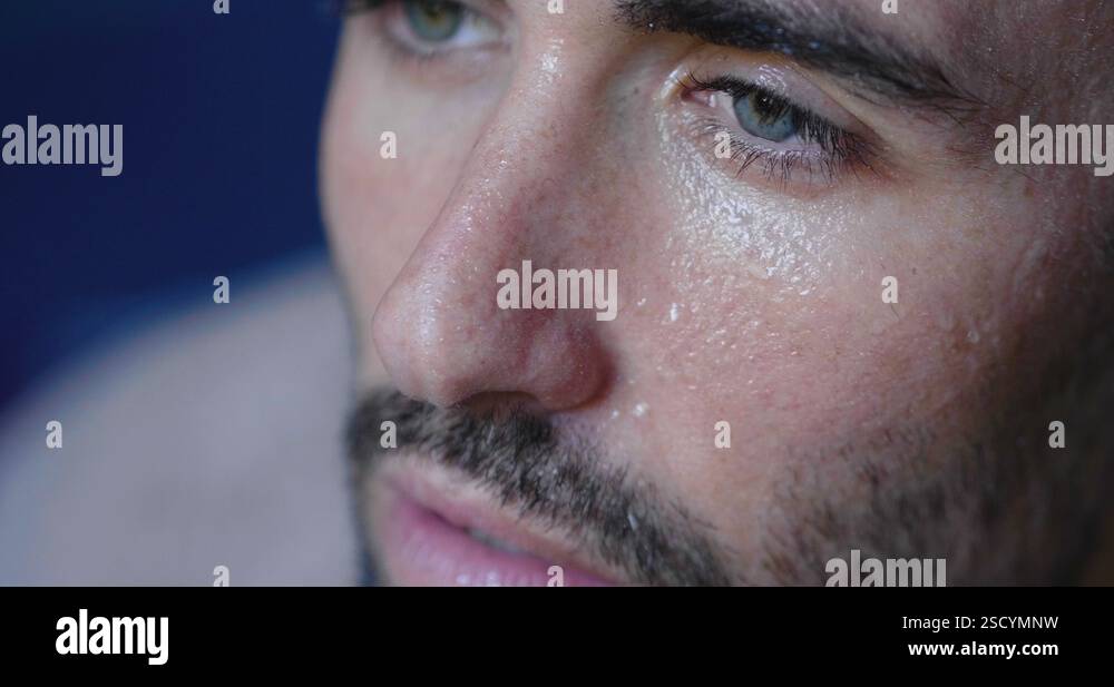 A professional sweated boxer is taking a break after training in gym ...