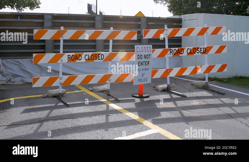 Close Up of Road Closed Barrier at Flood Wall With Lens Flare Stock ...