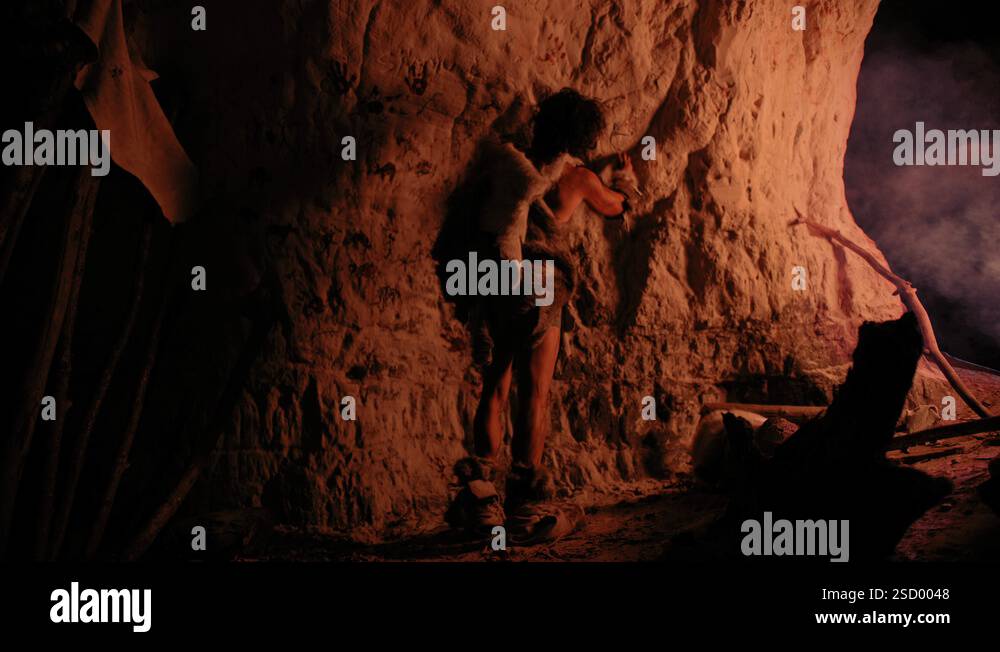 Primitive Prehistoric Neanderthal Wearing Animal Skin Draws Animals on ...