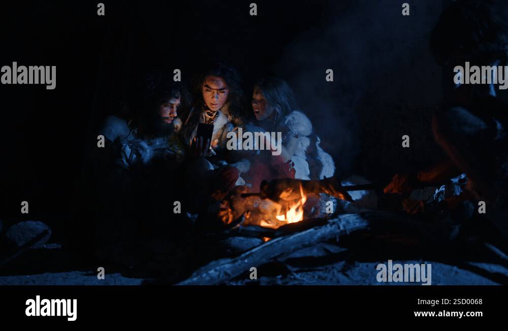 Tribe of Prehistoric, Primitive Hunter-Gatherers Wearing Skins Use ...