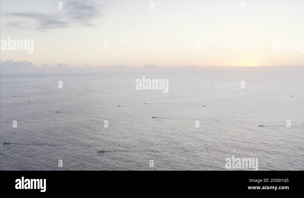 Aerial static view of fishing motor boats on calm ocean surface. Sunset ...