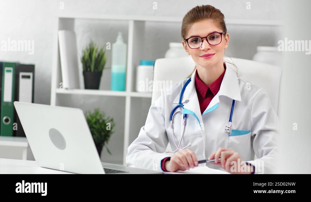 Professional young medical worker enjoying break at modern white clinic ...