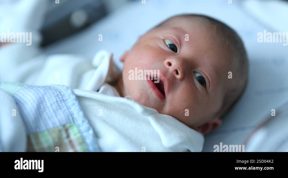 Newborn baby at hospital nursery after birth, first day of infant life ...