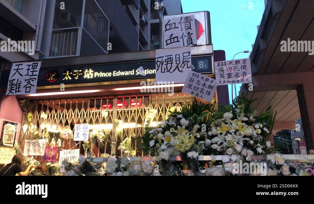 Flowers and other symbols of mourning at exit of Prince Edward MTR ...
