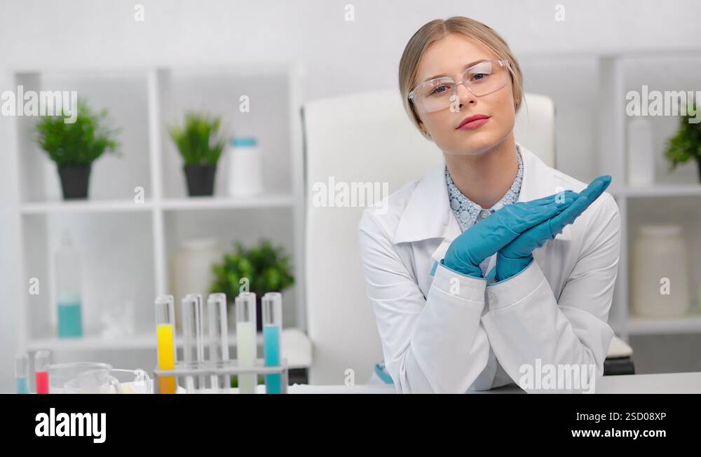 Beautiful young European female doctor biologist science in safety ...