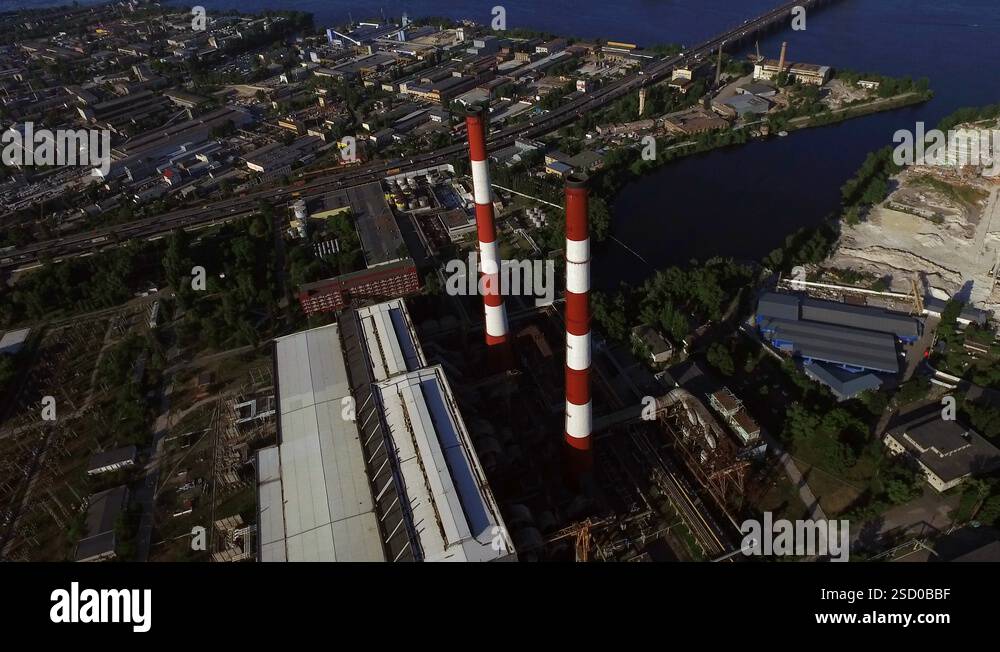 Chimney on industrial plant in city. Aerial view industrial pipe on ...